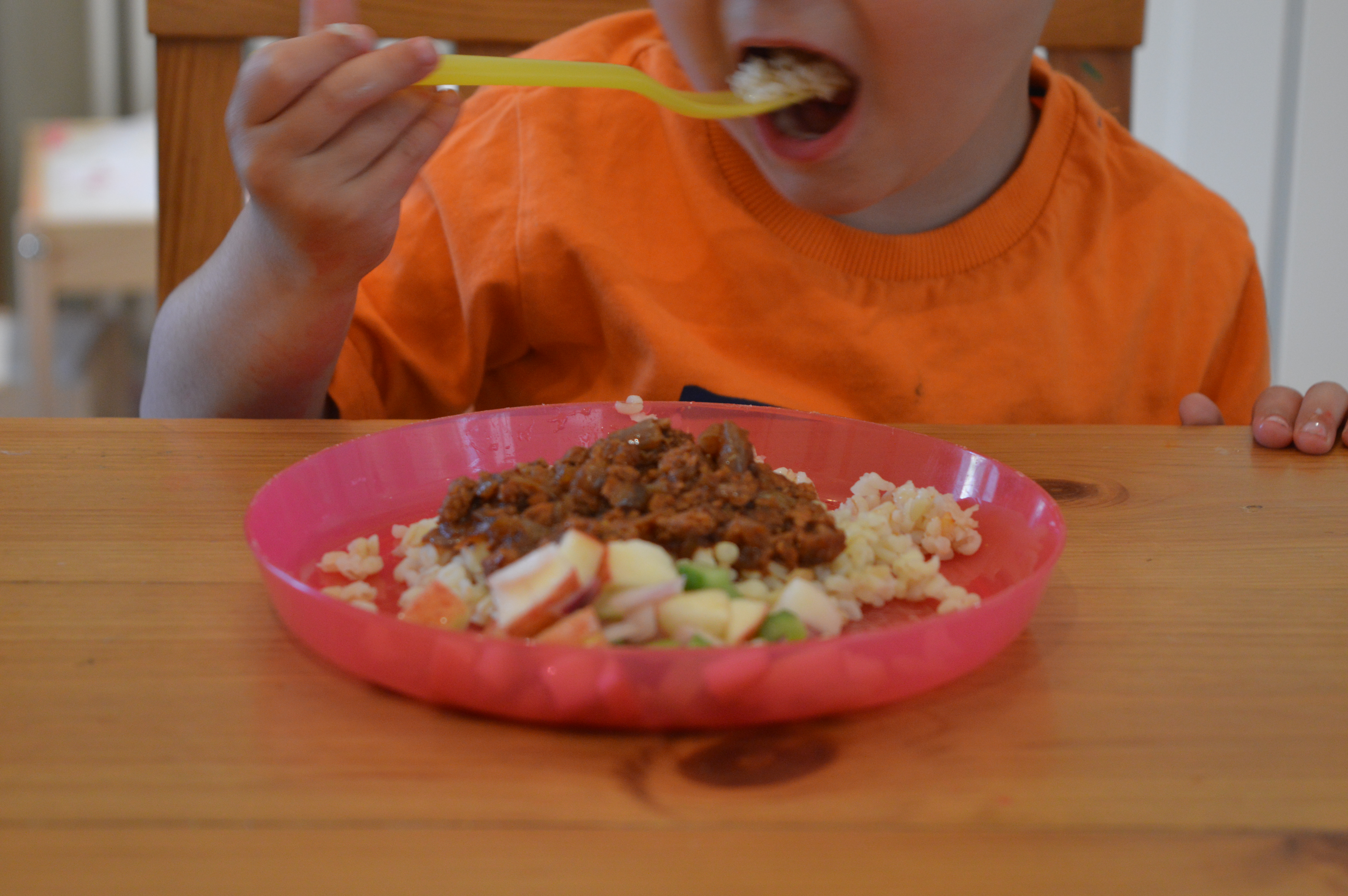 Little boy eating chilli con carne - There We Go