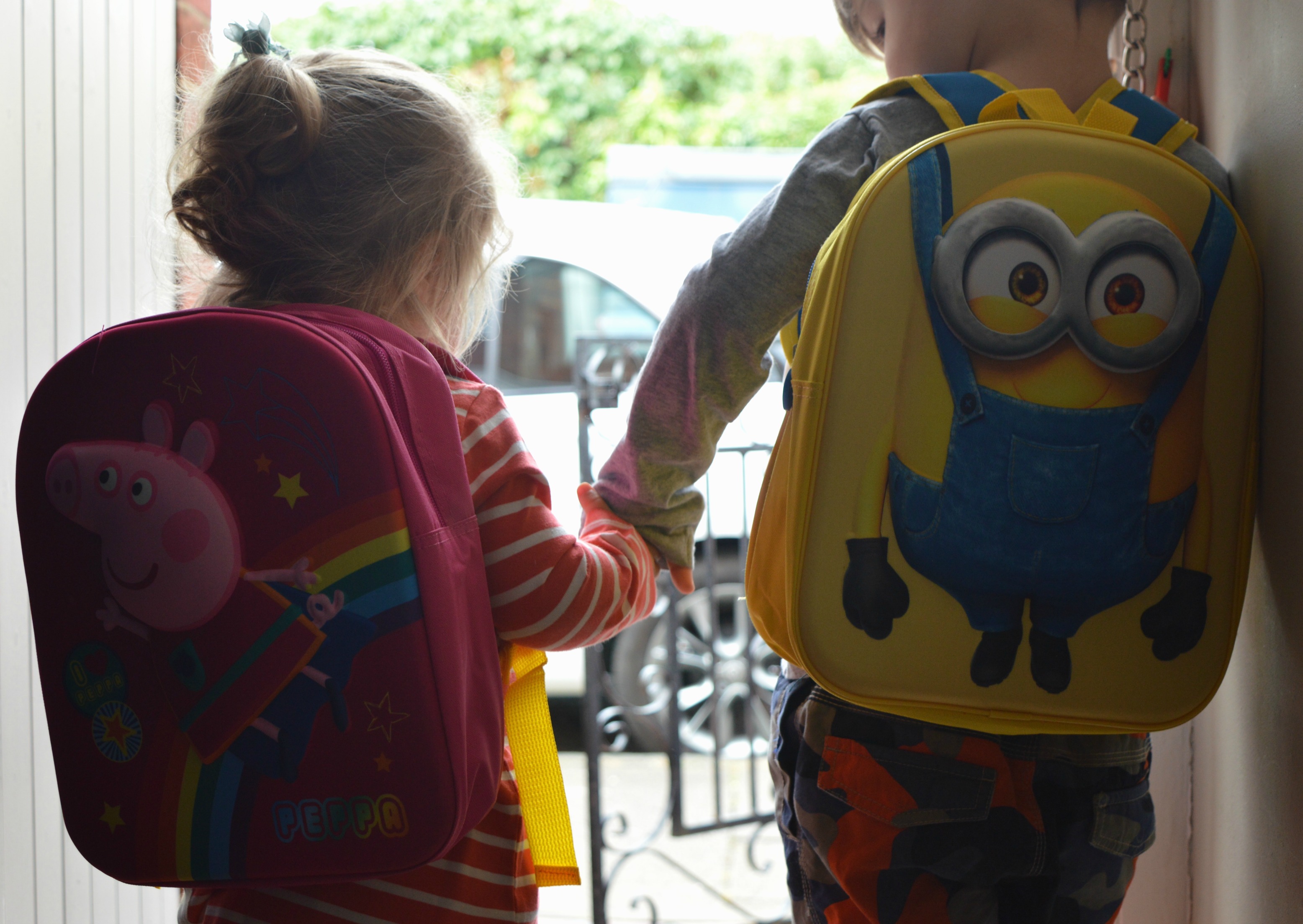 Children wearing rucksacks - There We Go